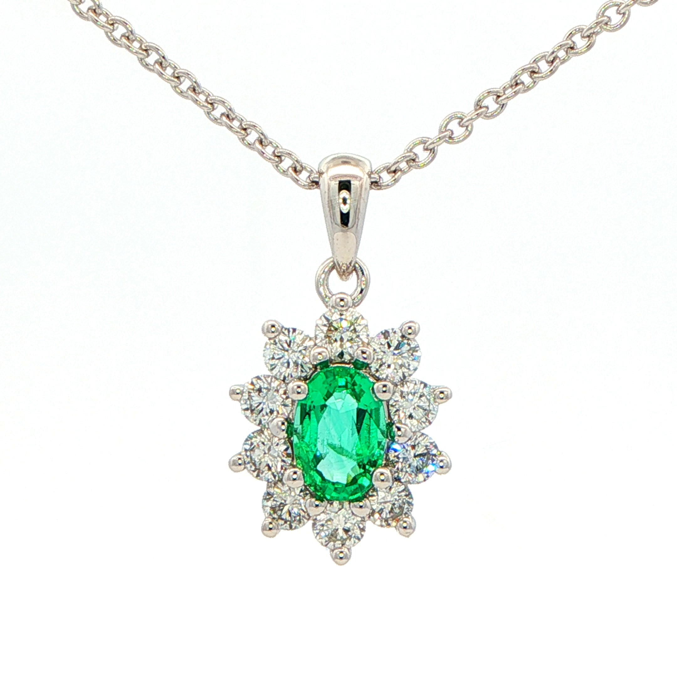 Oval shaped emerald and round brilliant cut diamond cluster pendant ...