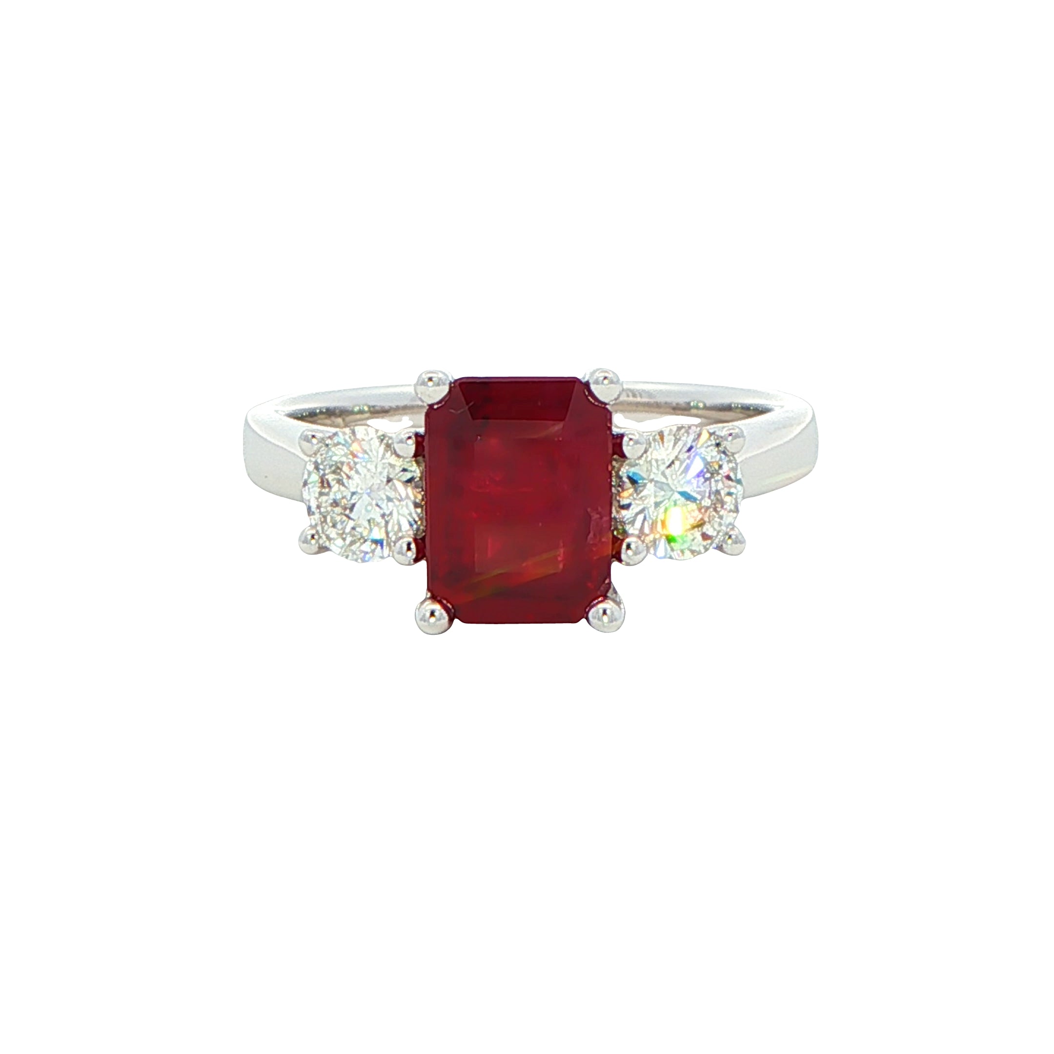 Octagonal shaped ruby with round brilliant cut diamond 3 stone ring ...